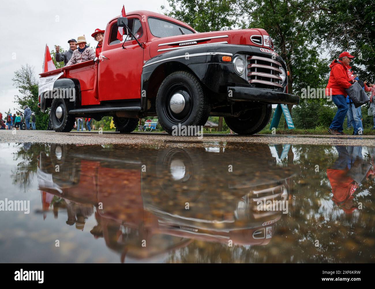 Cremona, Canada. 01st July, 2024. A vintage truck is driven in a parade ...
