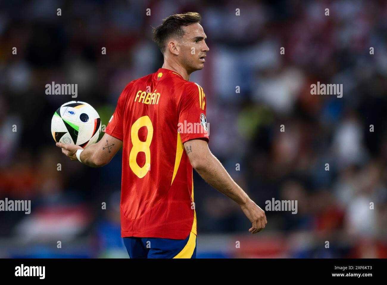 Cologne, Germany. 30 June 2024. Fabian Ruiz of Spain holds the ball ...