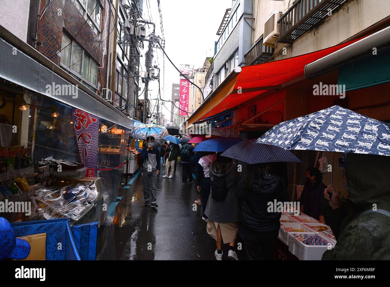 Tokyo Japan raining bad weather outside shop shops people rain cold ...