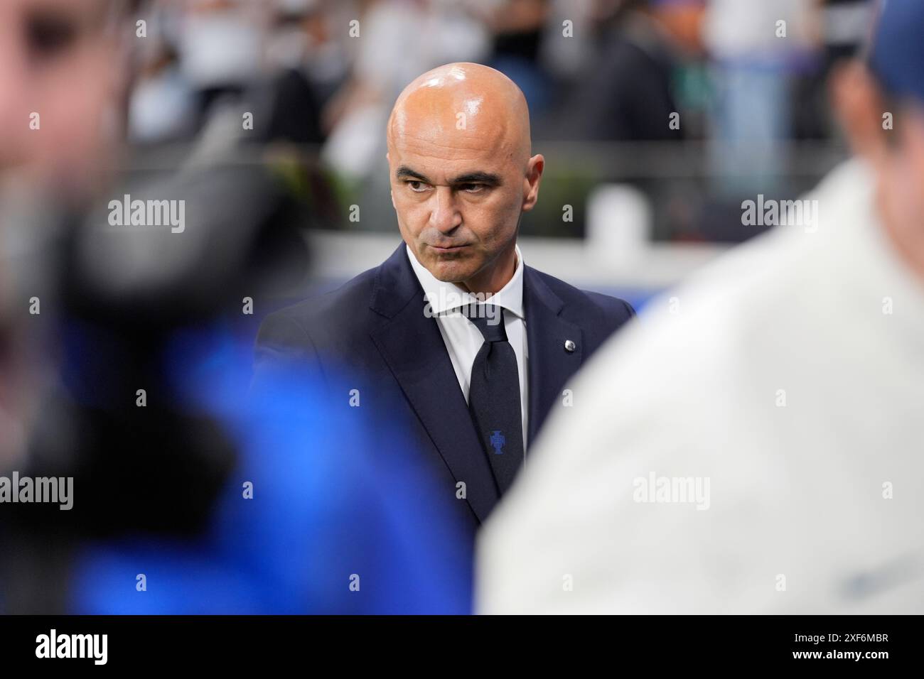 Portugal's head coach Roberto Martinez arrives on the pitch for a round ...