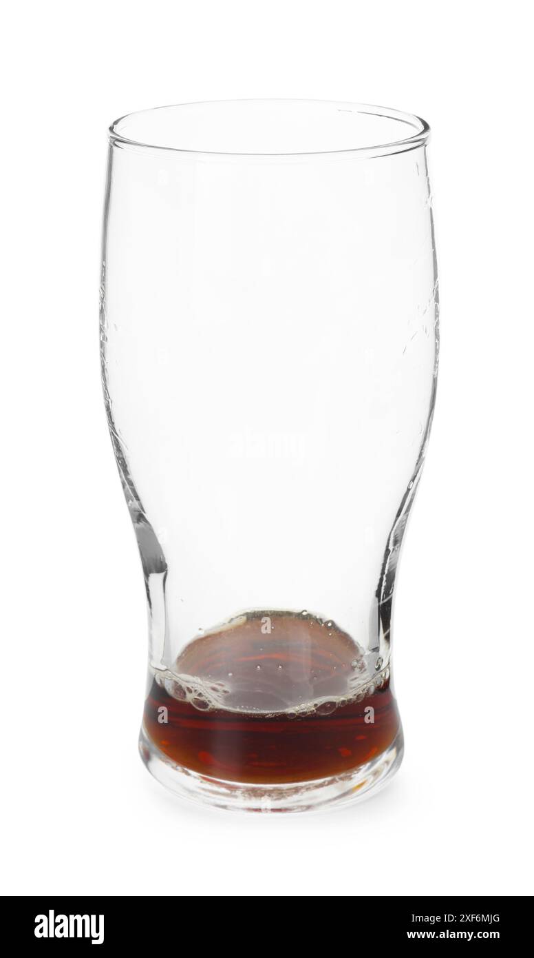 Almost empty glass of beer isolated on white Stock Photo - Alamy