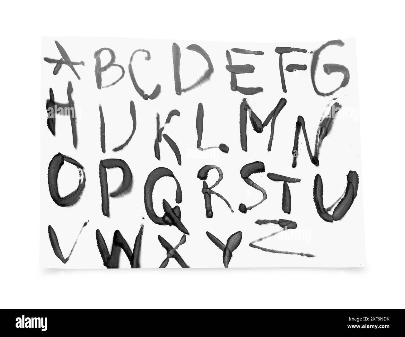 Alphabet written by grey spray paint isolated on white, top view Stock ...