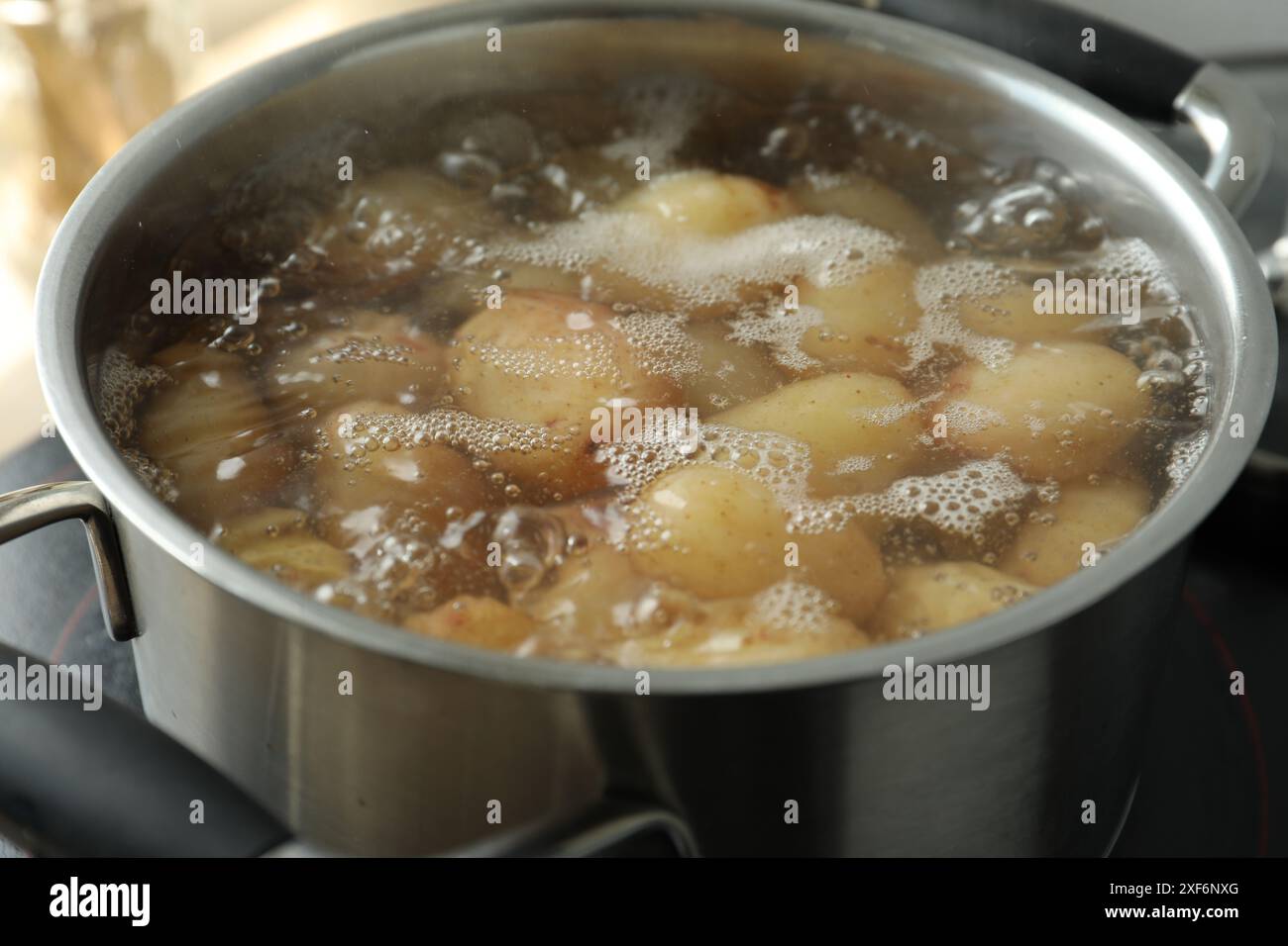 Boiling potatoes hi-res stock photography and images - Alamy