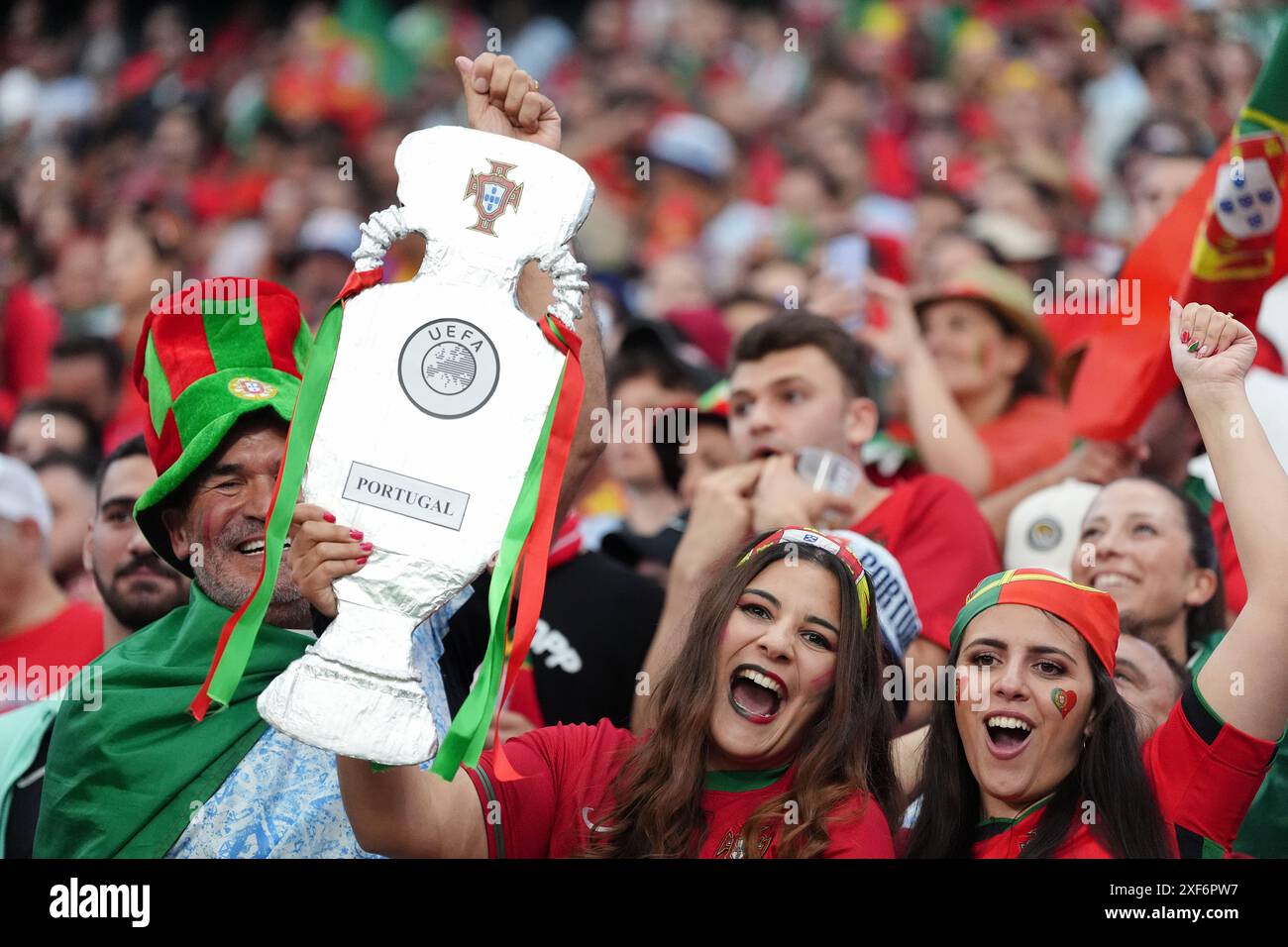 Portugal fans holding a tin foil replica Henri Delaunay Cup during the ...