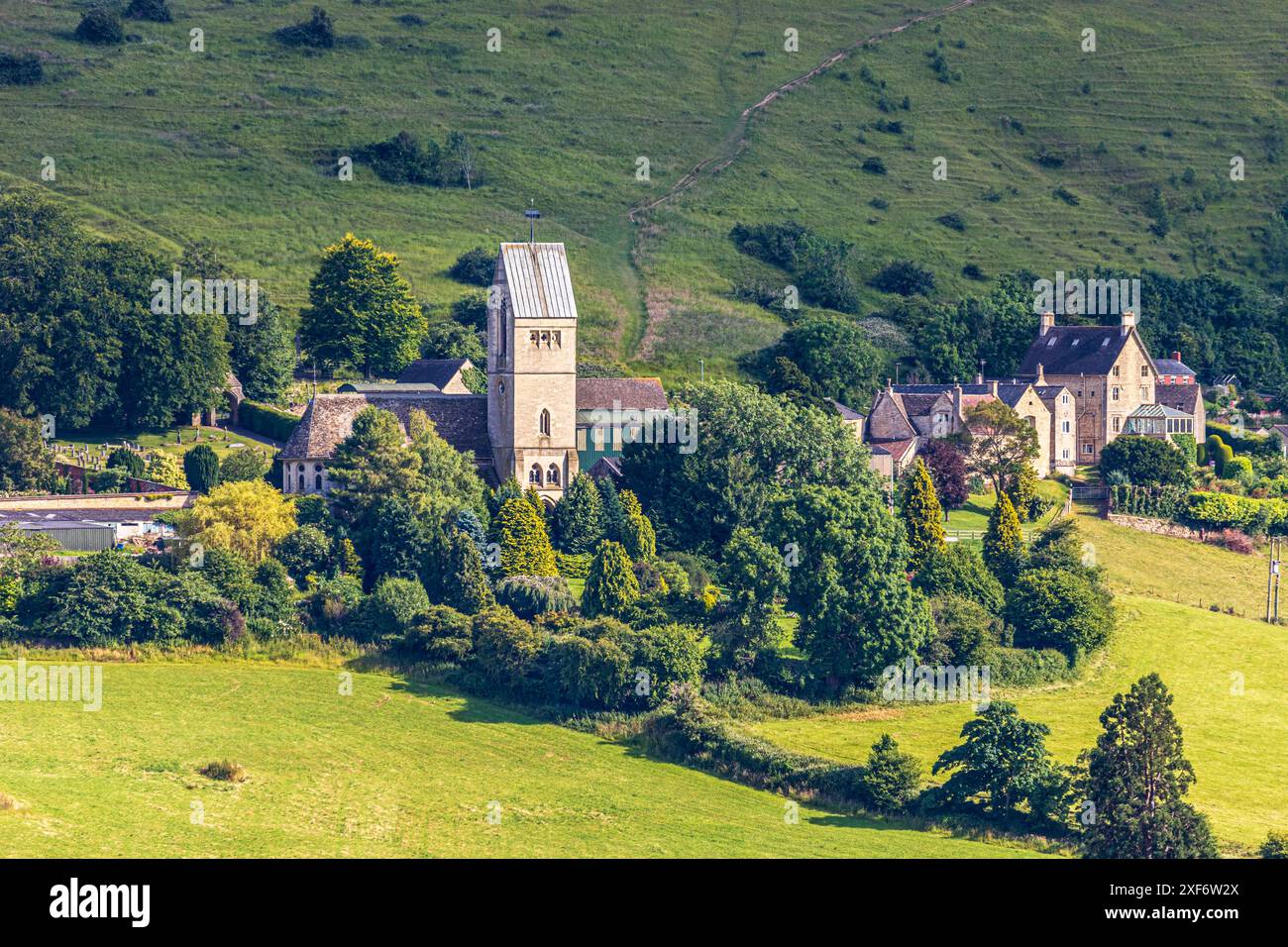 Evening light on the village of Selsley on the Cotswold escarpment ...