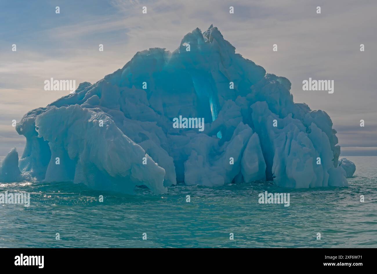 Looming Backlit Glacial Iceberg in the Ocean Near NordAustlandet Island ...