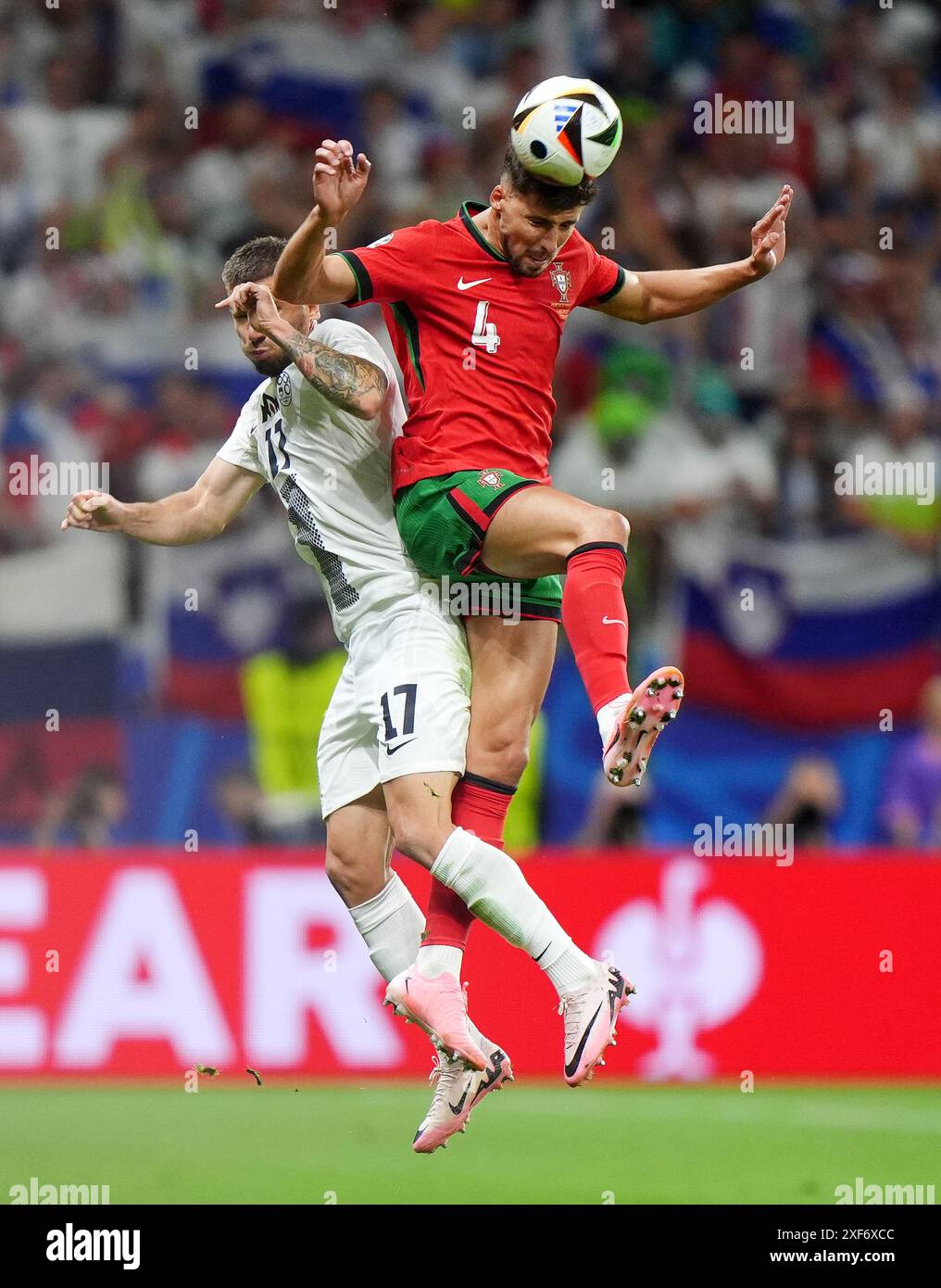 Portugal's Ruben Dias (right) and Slovenia's Jan Mlakar battle for a ...