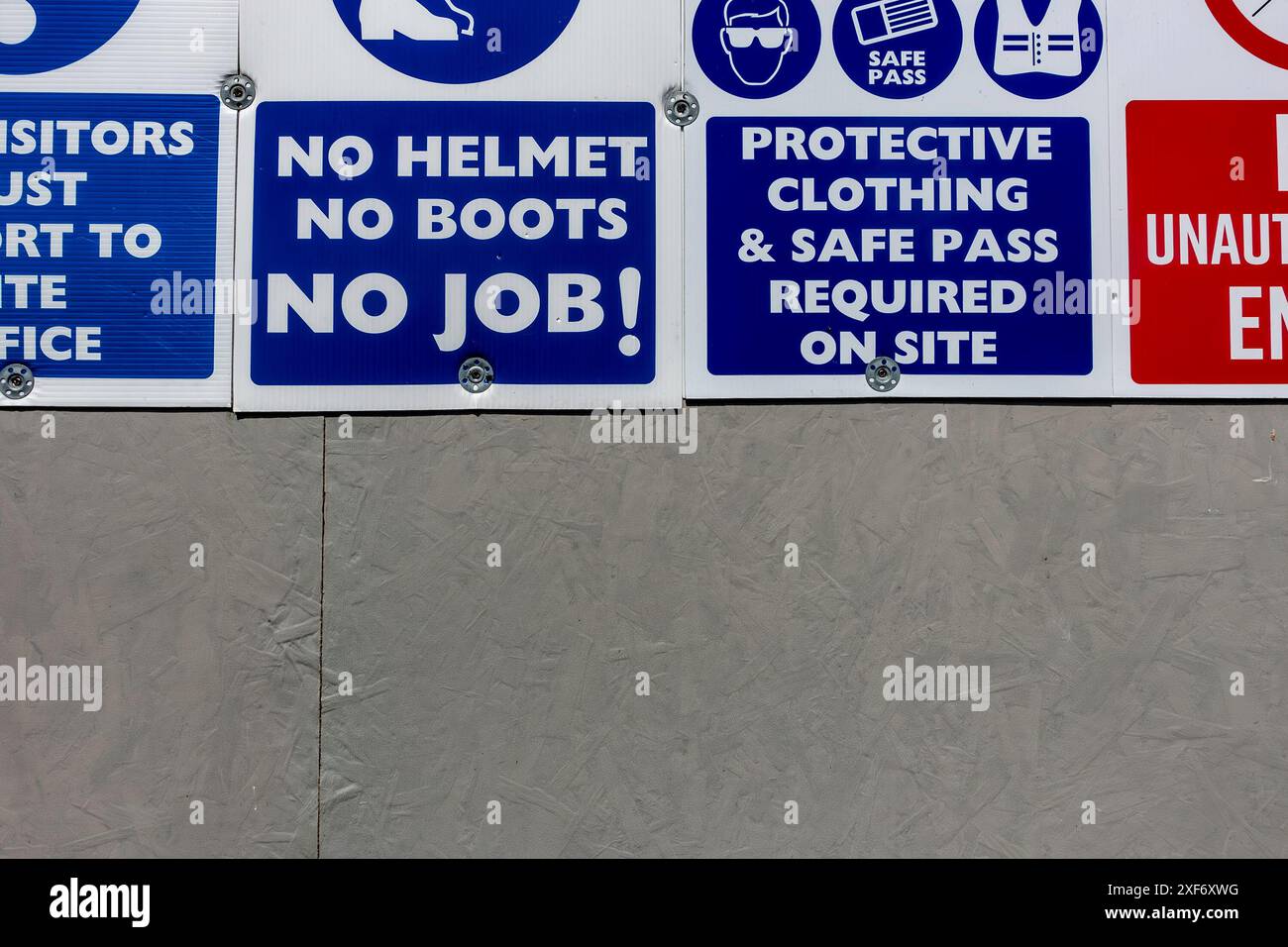 Safety Signs on Construction Site Wall, No Helmet No Boots No Job ...
