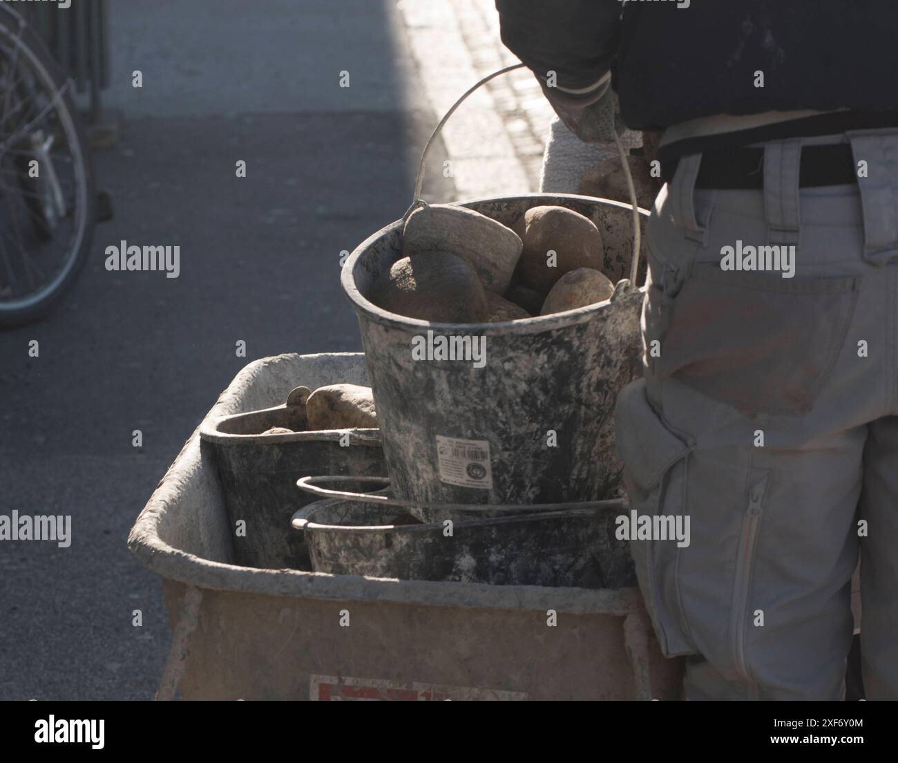 a stonemason working with stone, craft for construction and ...