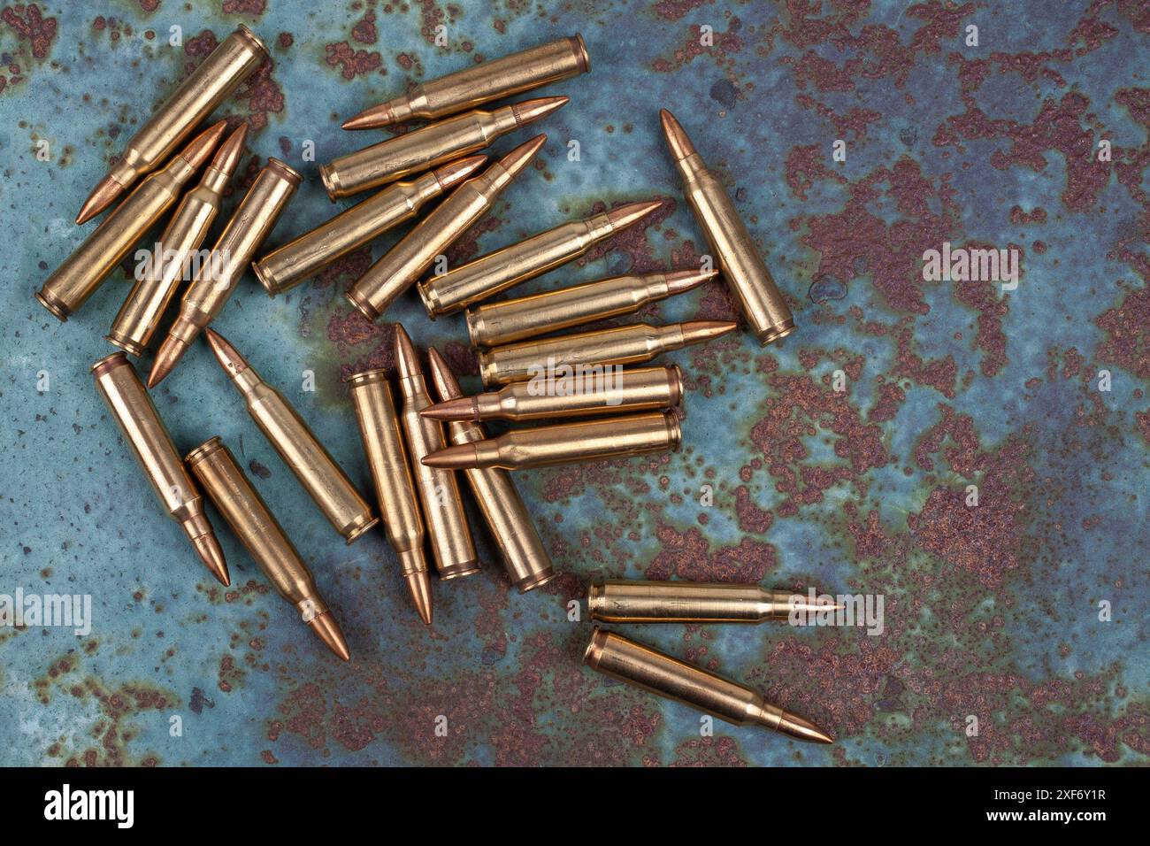 Ammunition on rust metal background Stock Photo - Alamy