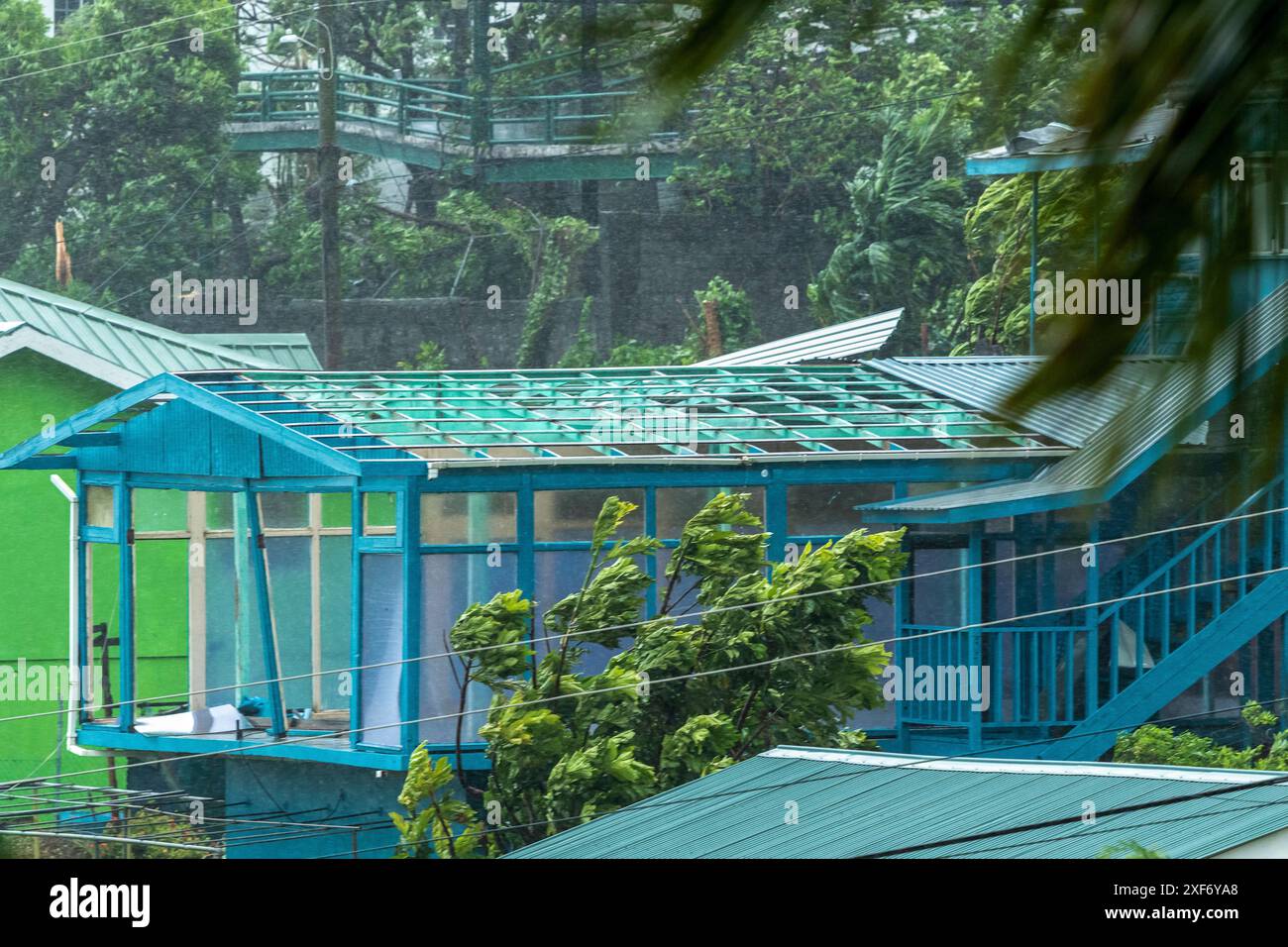 Wind blows past a house whose roof blew away during Hurricane Beryl in ...