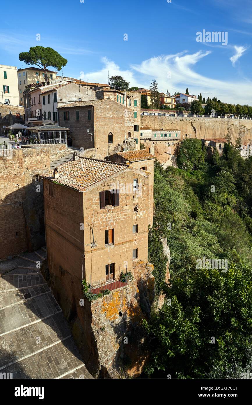 view of historic stone buildings built on tuff rock in the town of ...
