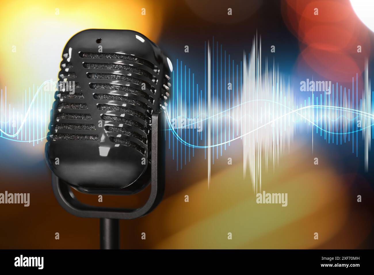 Microphone and audio waveform on blurred background Stock Photo - Alamy