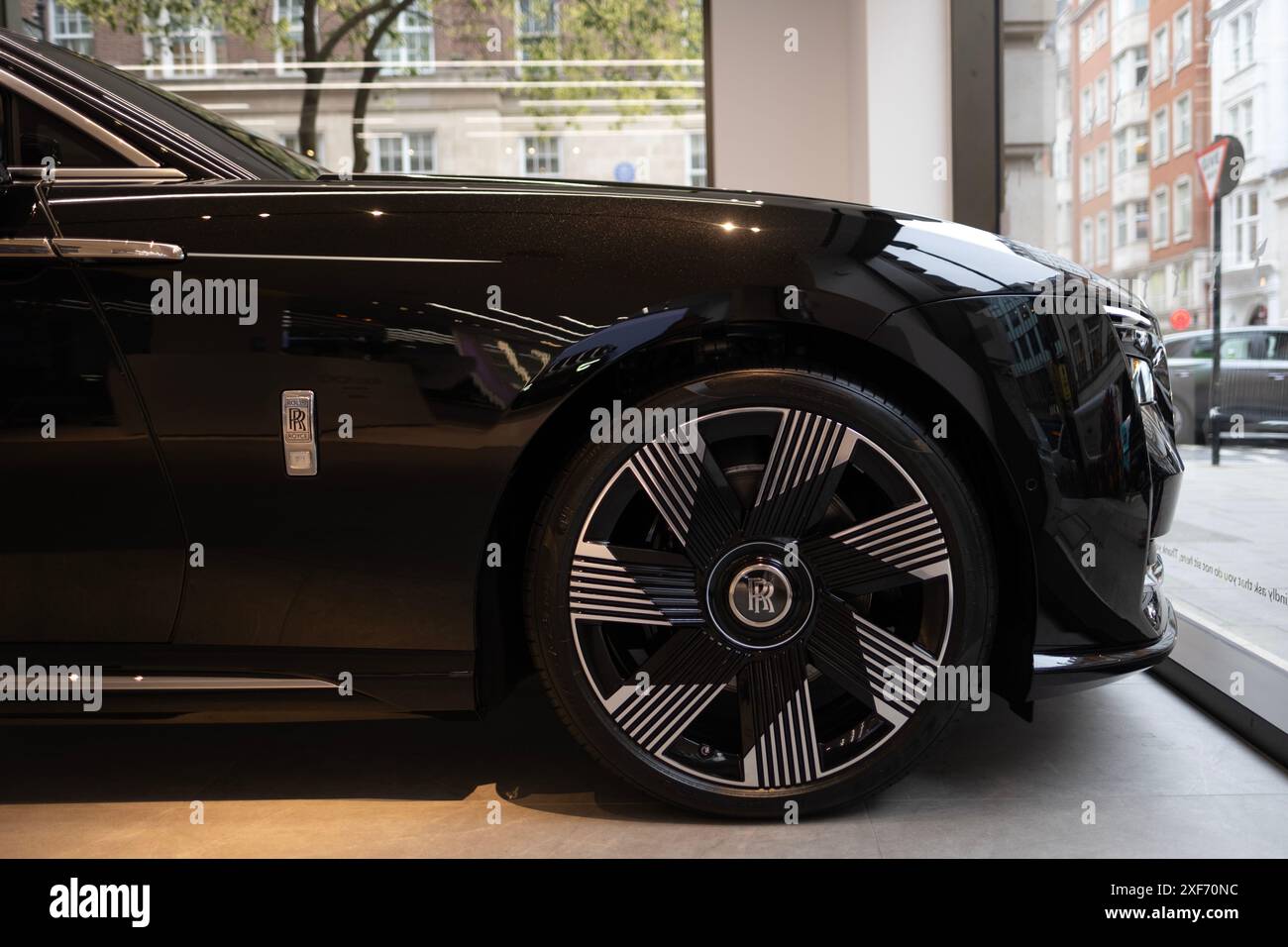 wheel of British black luxury limousine Rolls-Royce Phantom VIII with ...