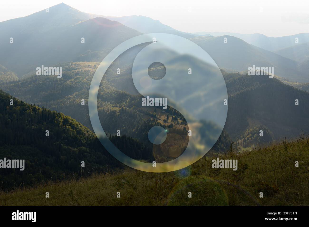 Yin and yang symbol against picturesque mountain landscape Stock Photo ...