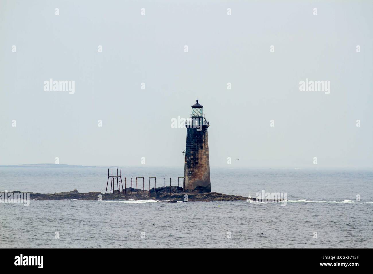 Ram Island Ledge Lighthouse on islad off coastal Maine with blue skies ...