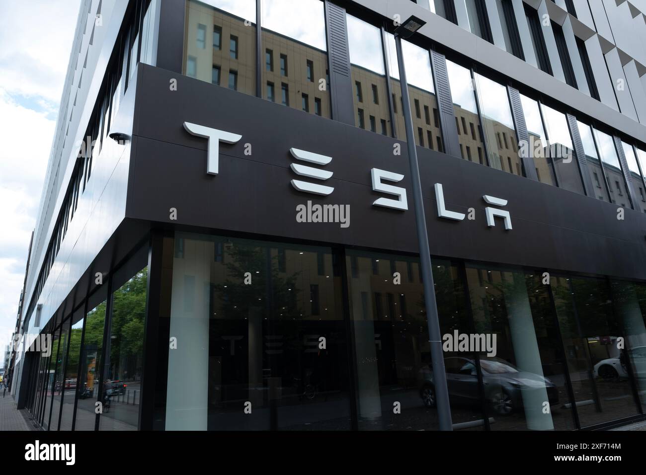 advertising logo Tesla Motors on facade, electric cars company elon ...