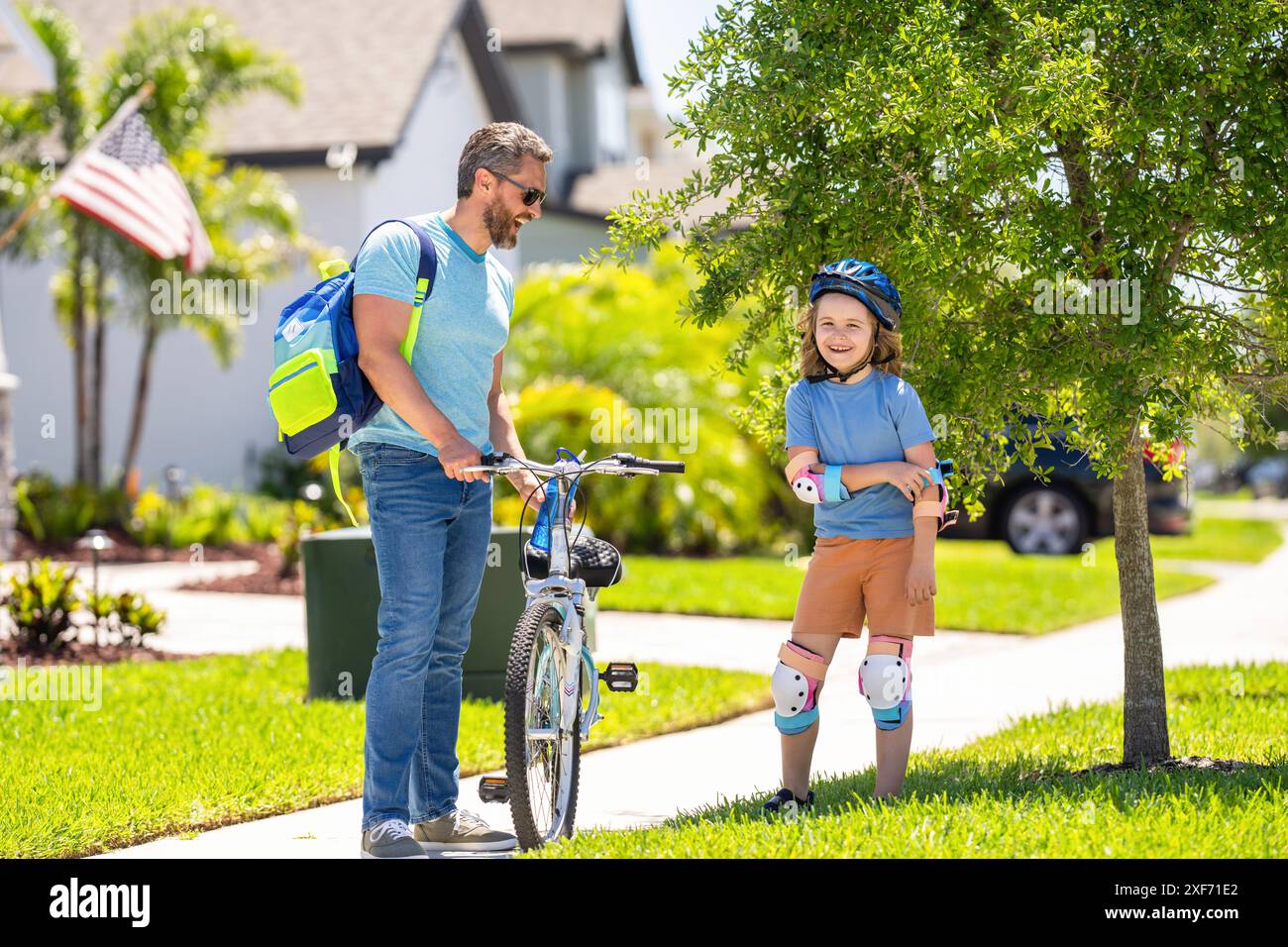 dad and son duo pedaling through picturesque landscape. Biking ...