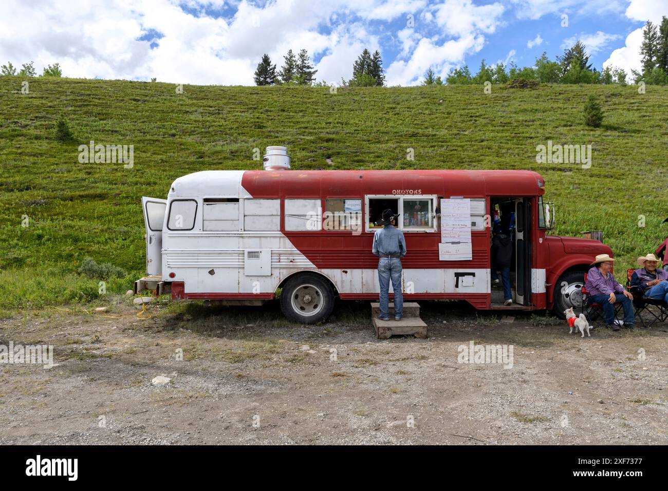 Food vendor selling snacks in a converted school bus at the Mini Thni ...