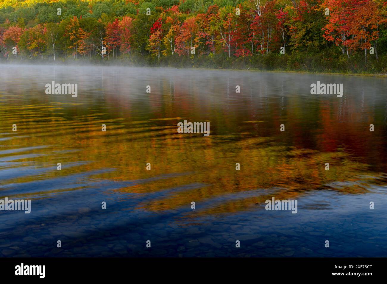 USA, Maine. Colorful foliage reflected in South Branch Pond, Baxter ...