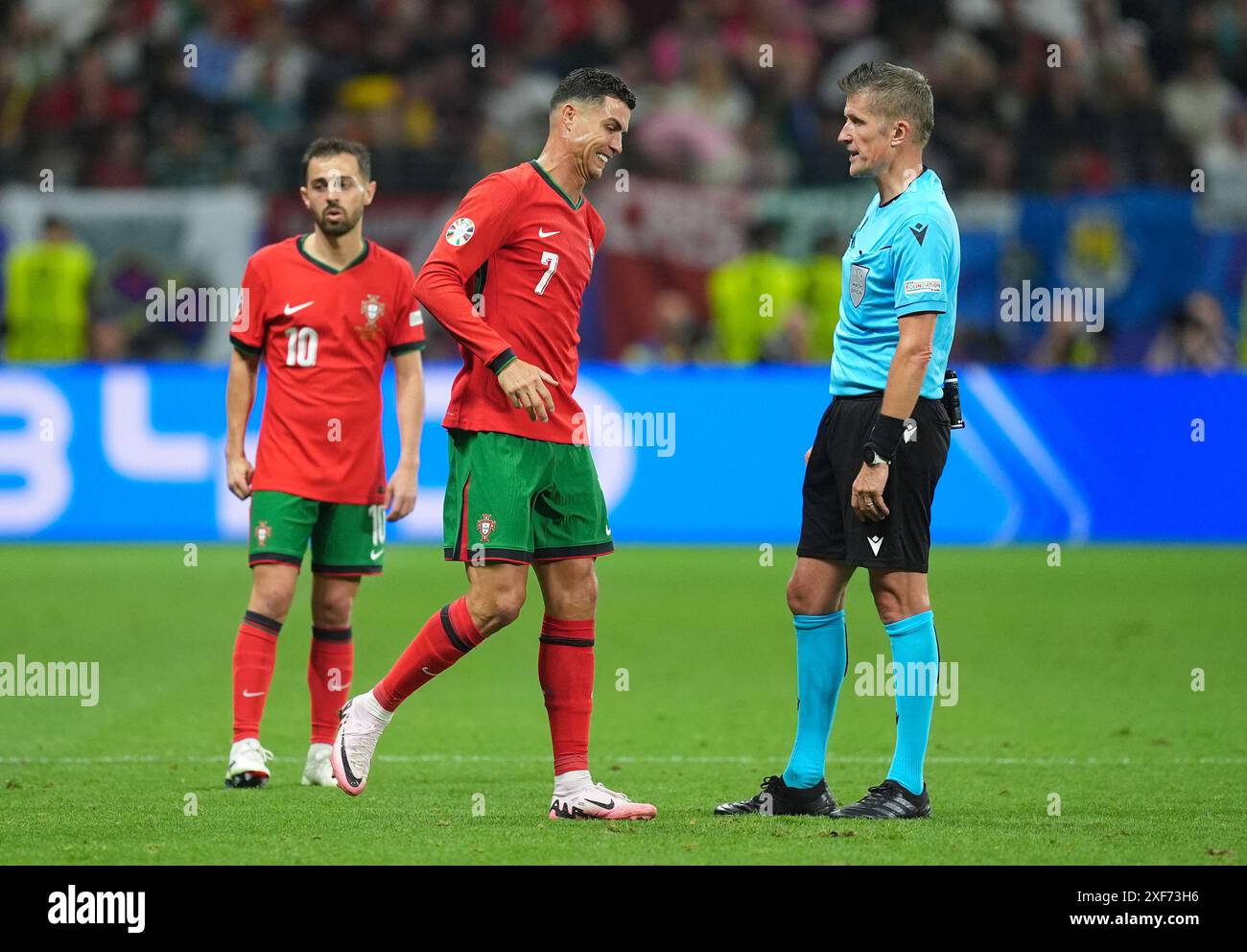 Portugal's Cristiano Ronaldo reacts after Bruno Fernandes accidently ...