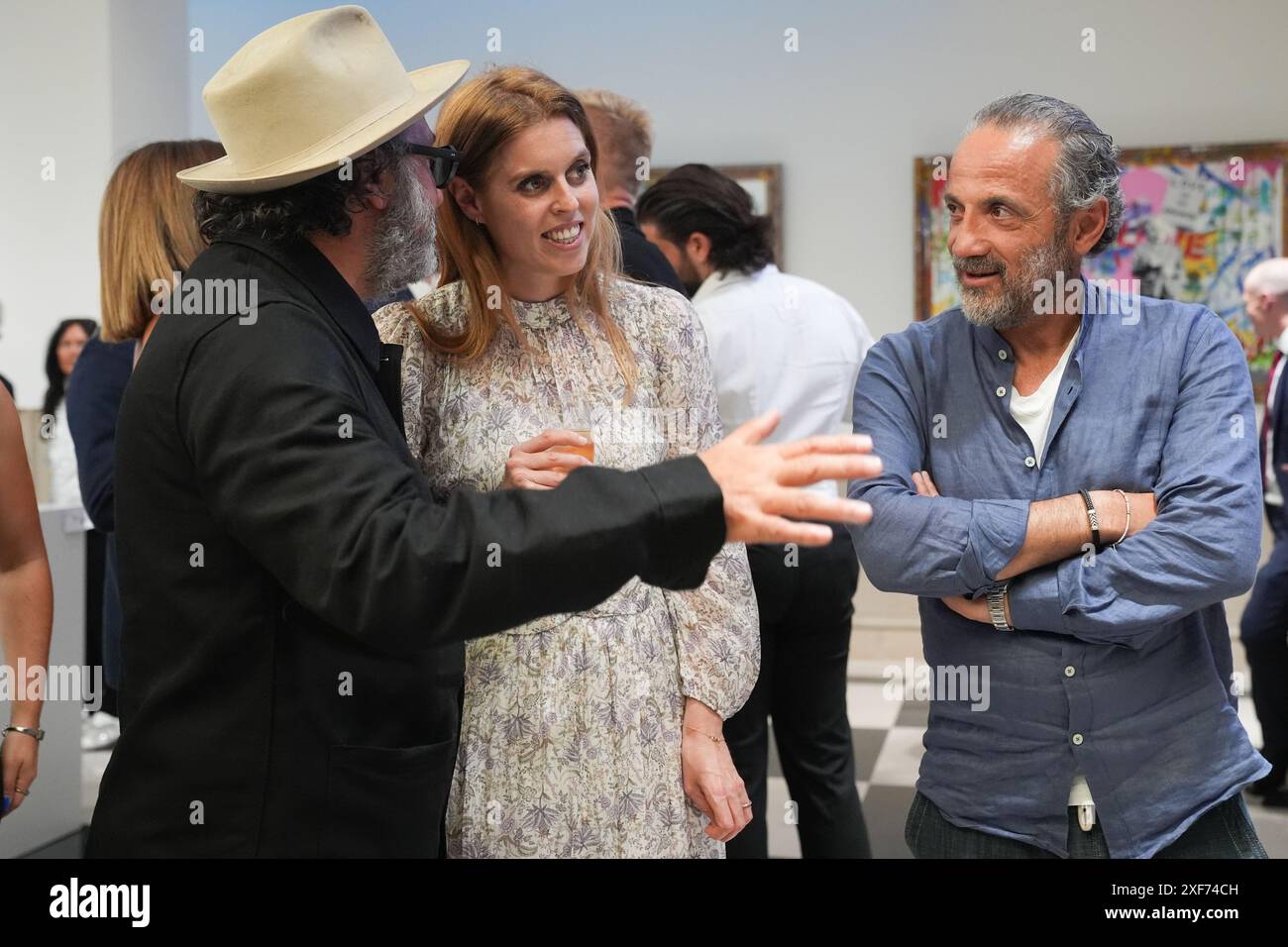Mr Brainwash (left) and Princess Beatrice (centre) attend the unveiling ...