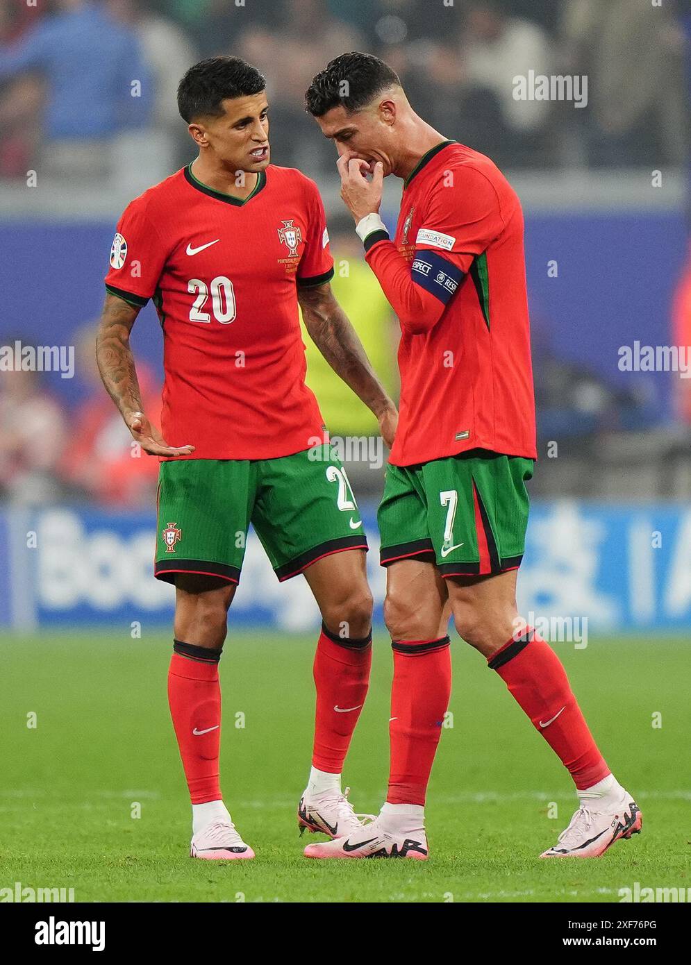 Portugal's Cristiano Ronaldo (right) is consoled by Joao Cancelo after ...