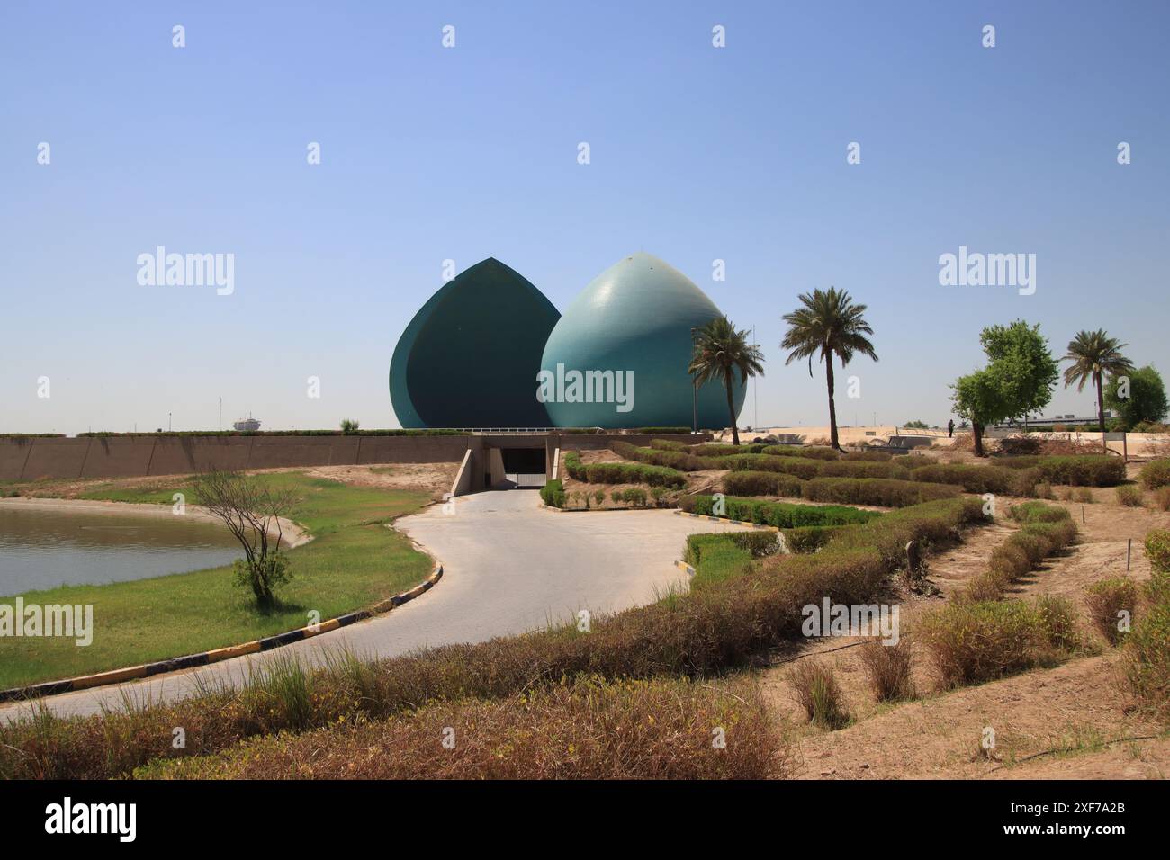 The Al-Shaheed Monument in Baghdad, Iraq, under a clear blue sky with ...