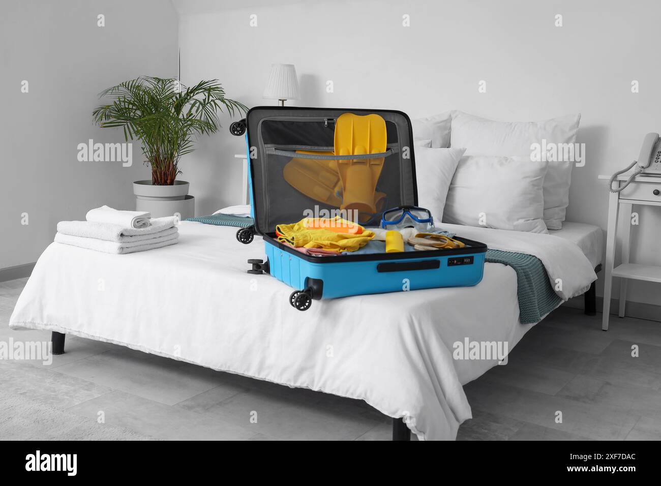 Interior of hotel room with suitcase on bed Stock Photo - Alamy