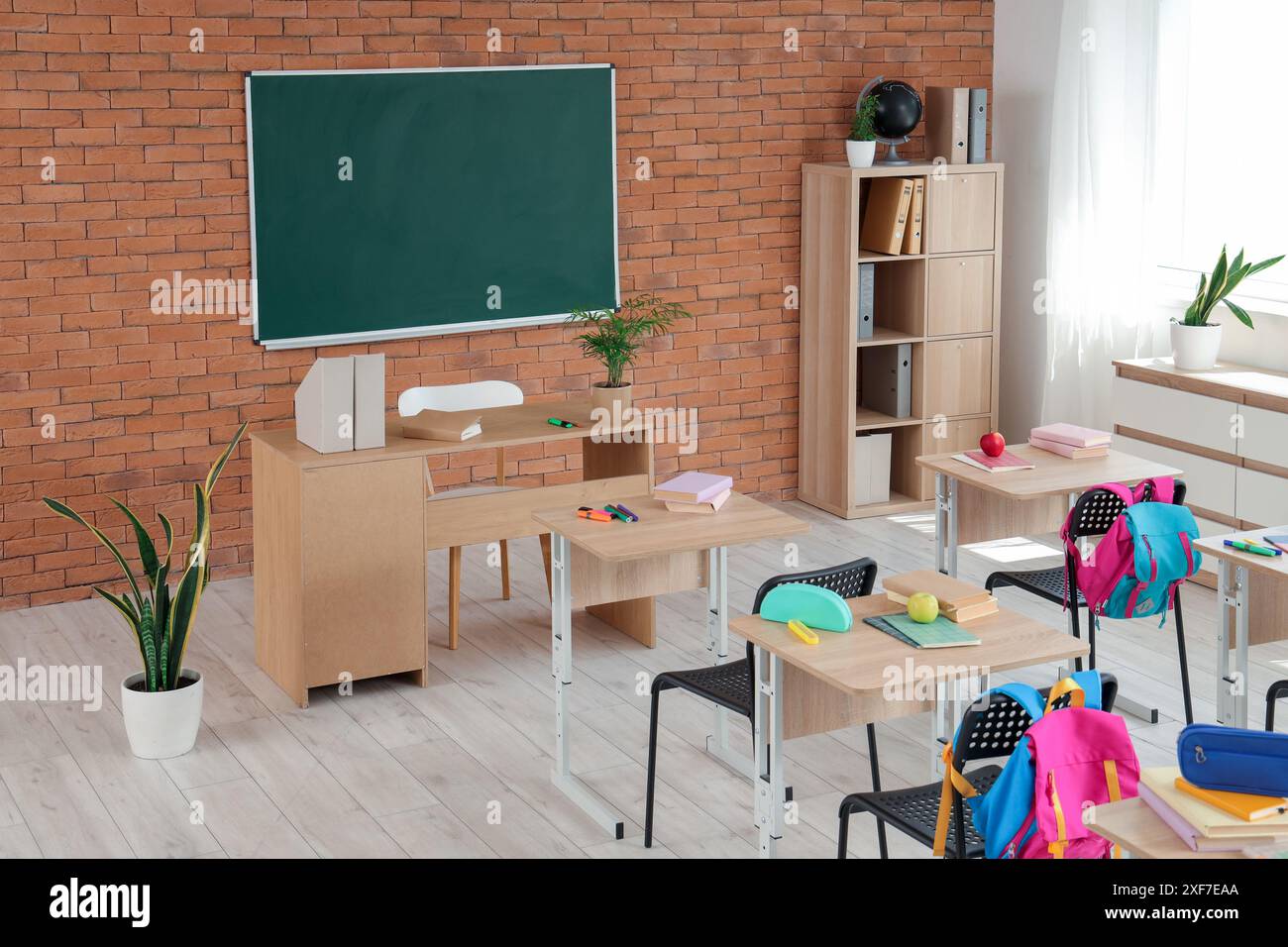 Interior of classroom with chalkboard, teacher's table and desks Stock ...
