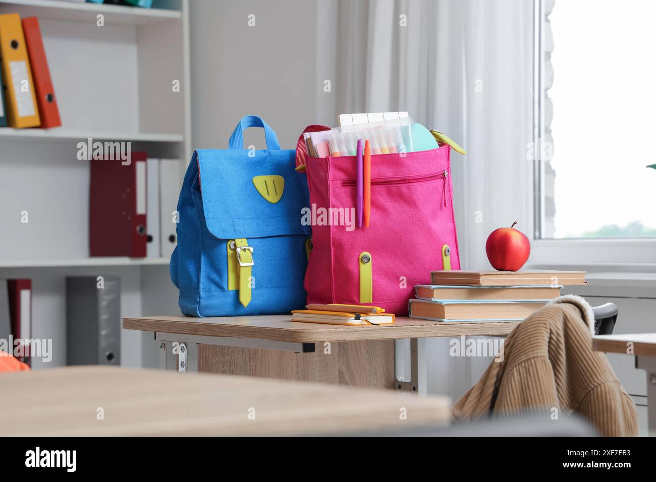 Children backpacks classroom table hi-res stock photography and images ...