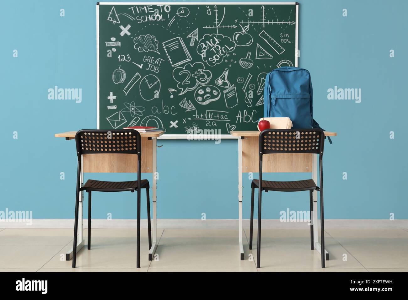 Interior of classroom with desks and chalkboard Stock Photo - Alamy