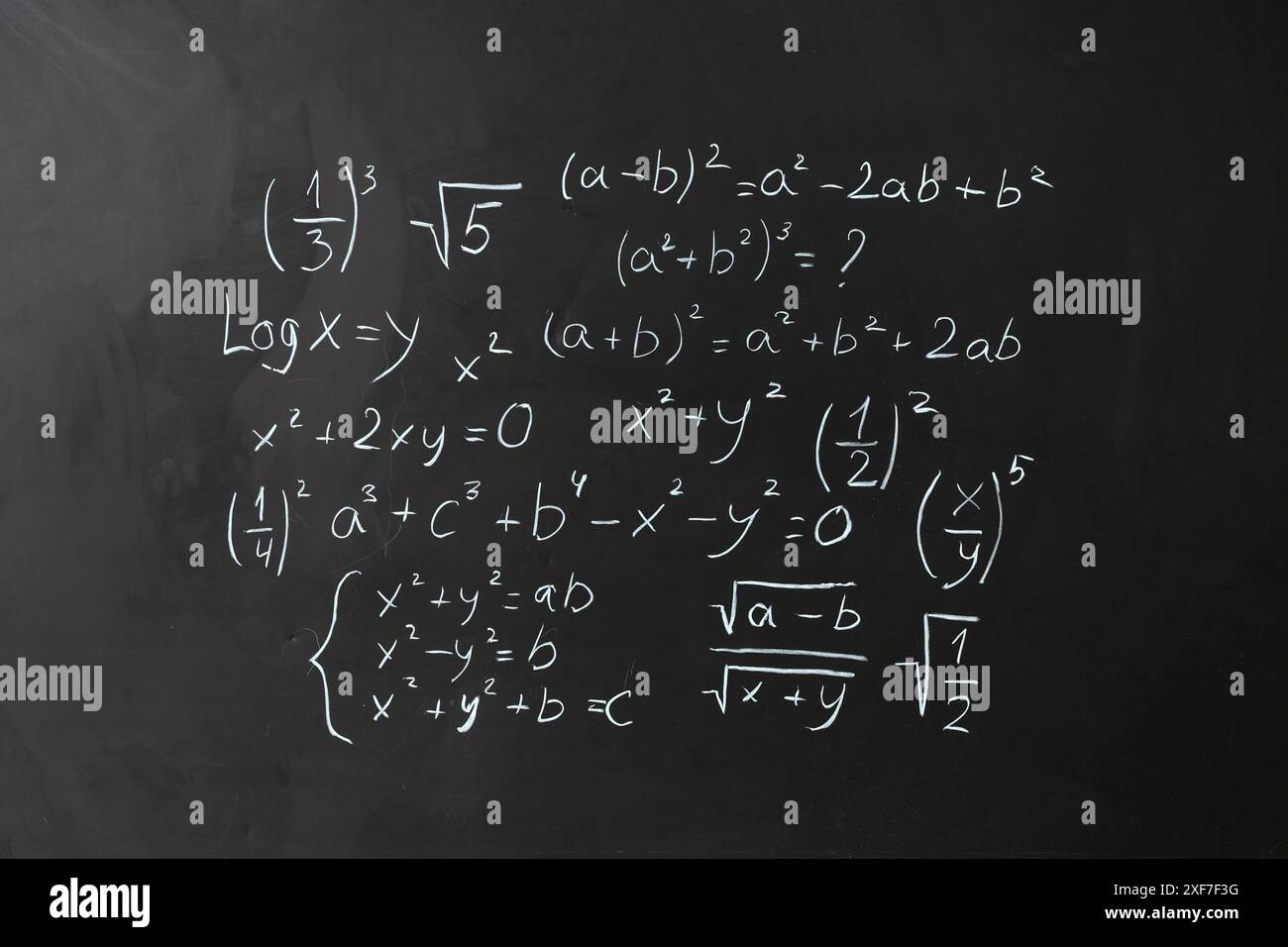 Different math formulas on black chalkboard Stock Photo - Alamy