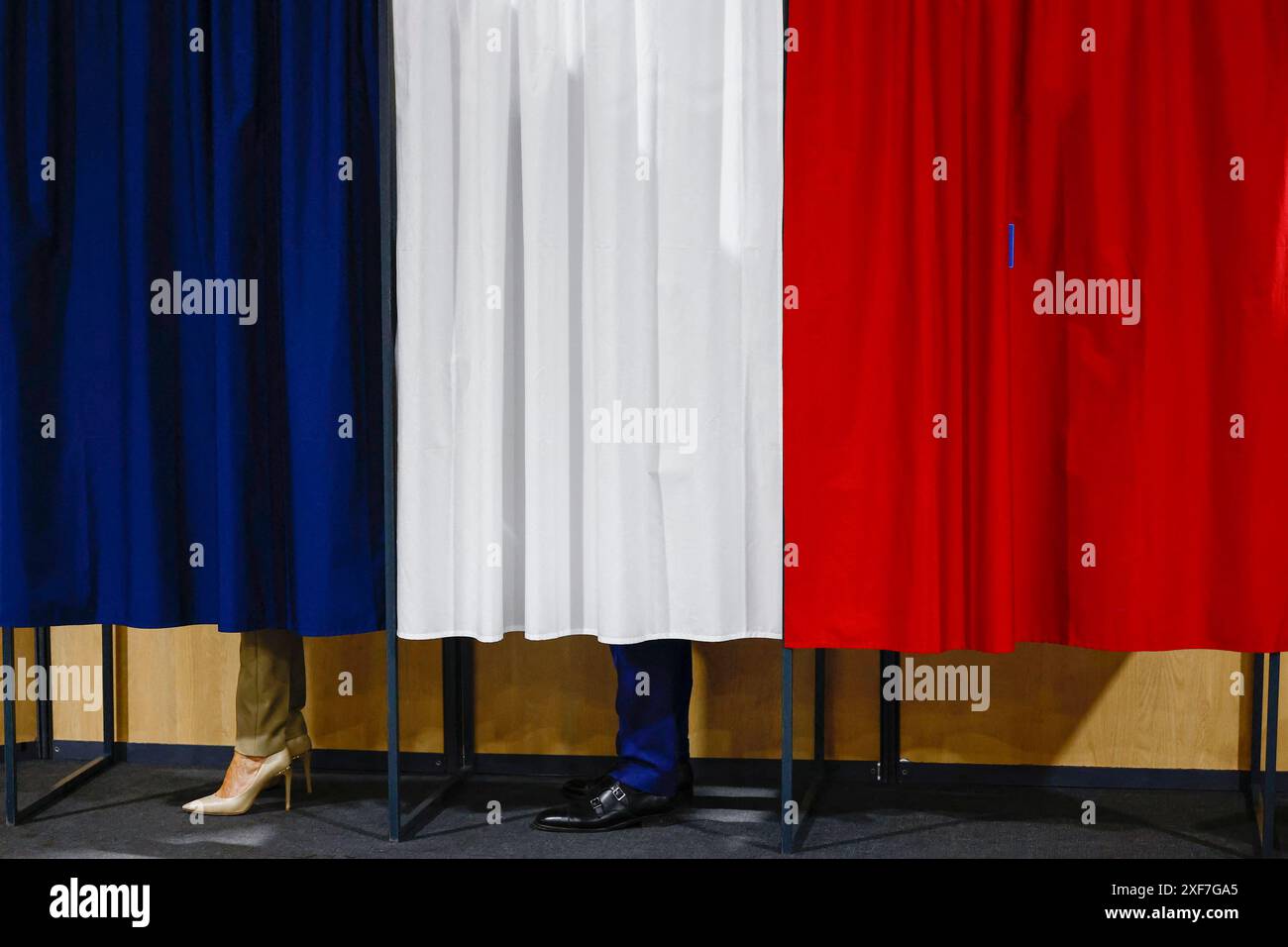 French President Emmanuel Macron and his wife Brigitte Macron stand in ...