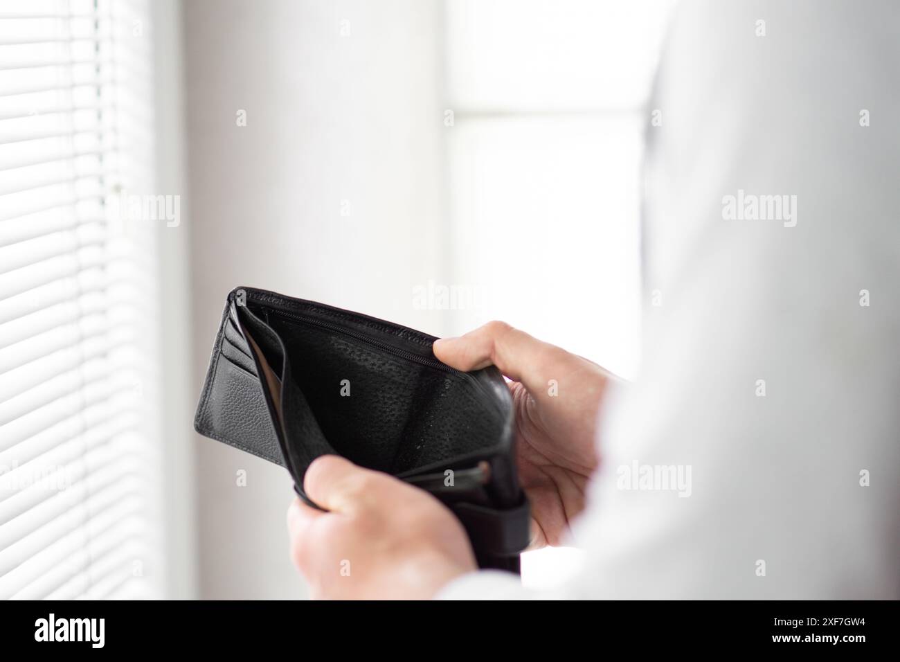 Sad man empty wallet hi-res stock photography and images - Alamy