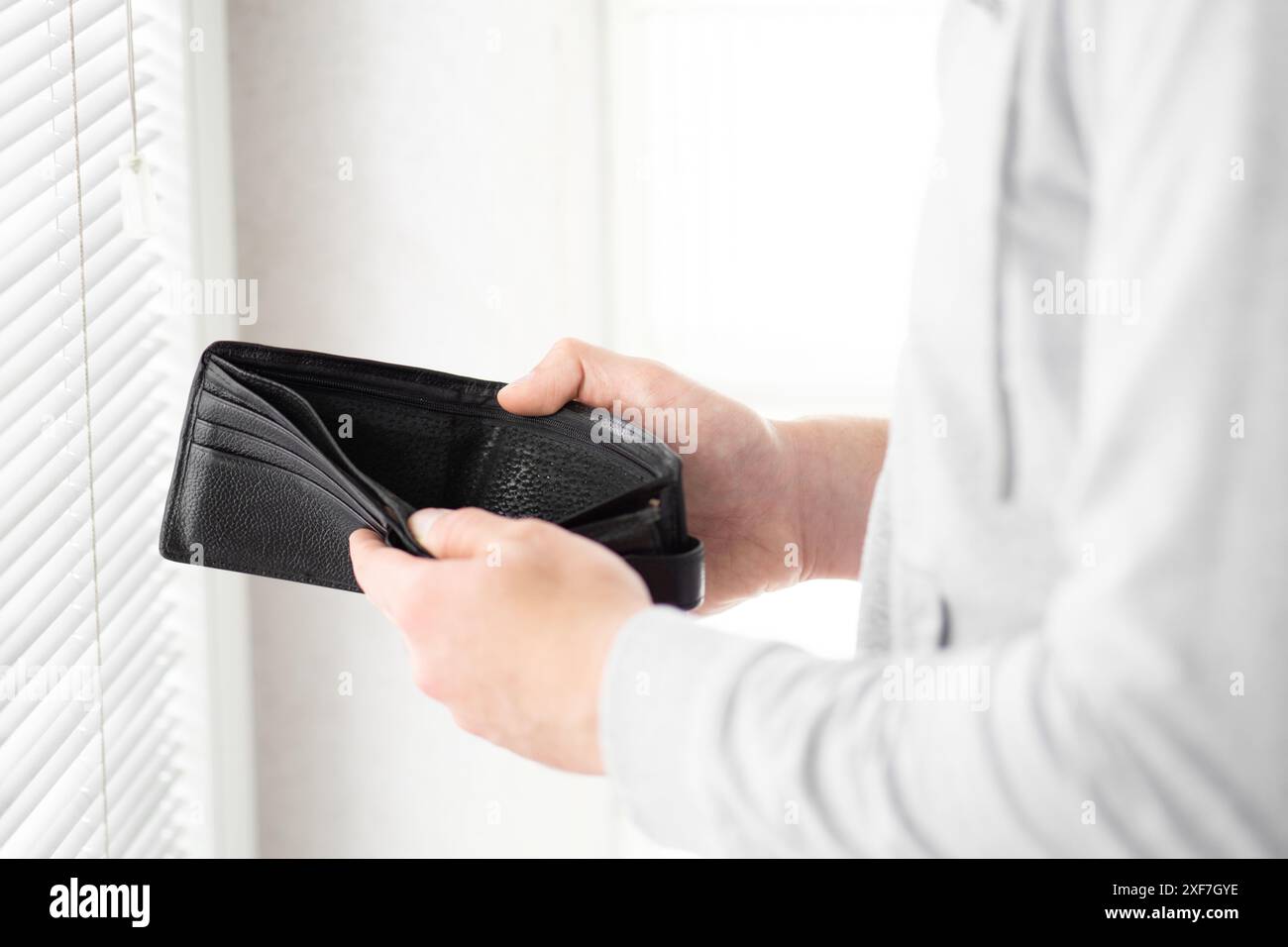 Sad man empty wallet hi-res stock photography and images - Alamy