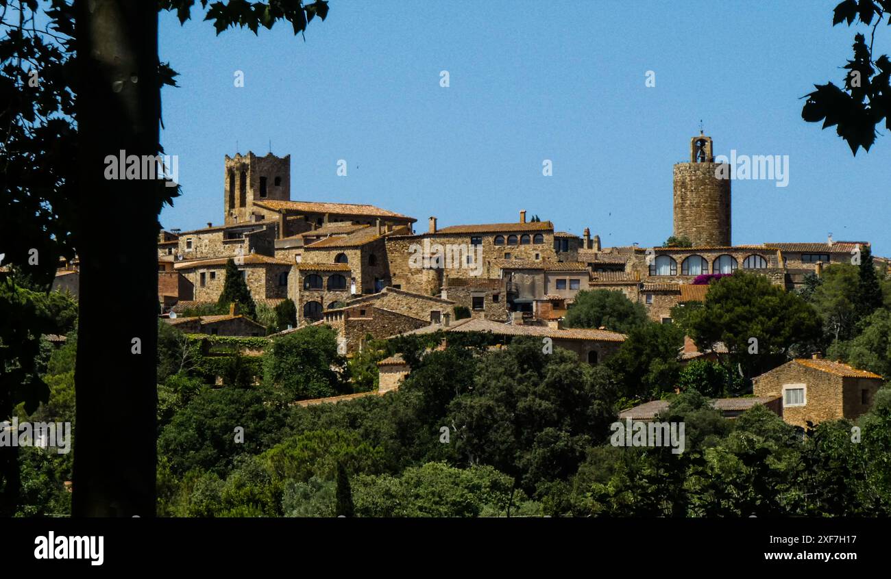 A scenic view of the medieval town of Pals, Spain, with historic stone ...