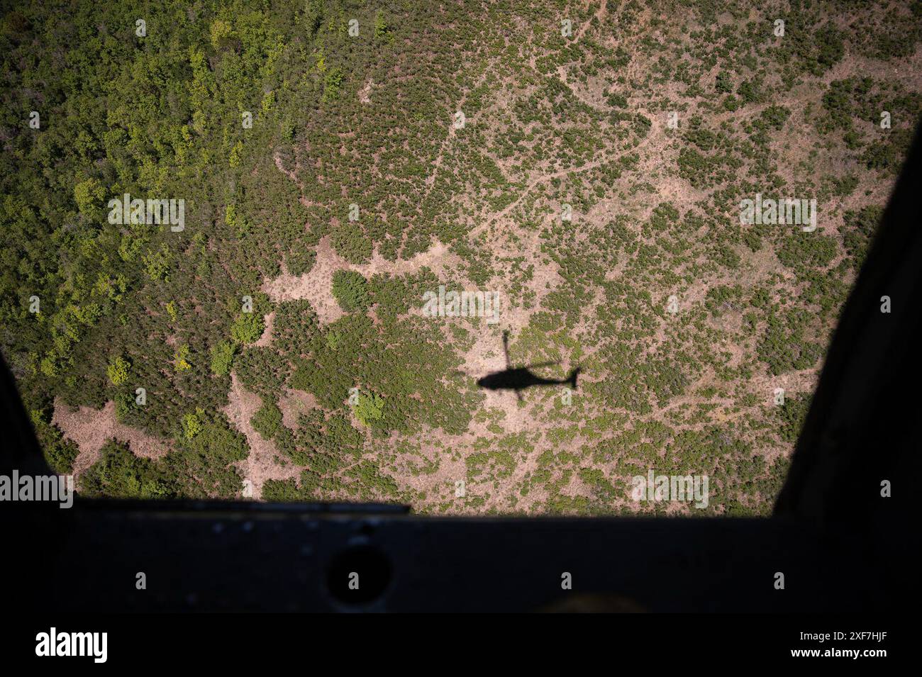 A UH-60 Black Hawk helicopter flies over mountains in Utah. Pilots fly ...