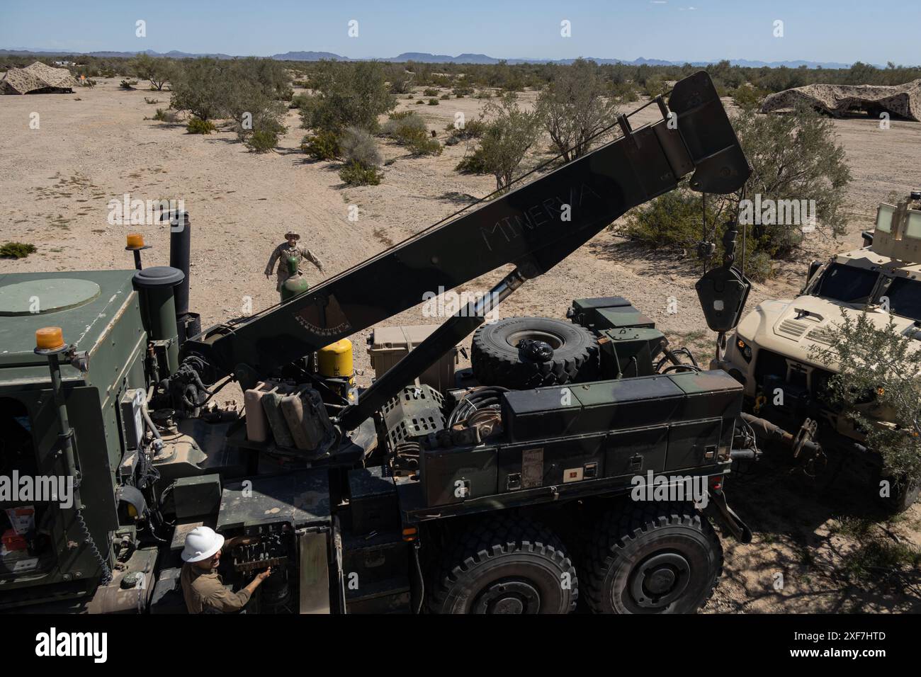 A U.S. Marine Medium Tactical Vehicle replacement wrecker pulls a Joint ...