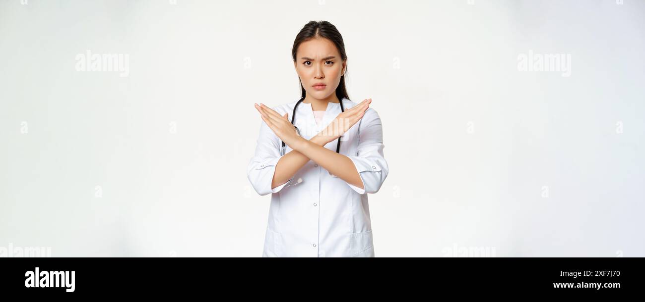 Serious asian woman doctor prohibit patient behaviour, showing stop ...
