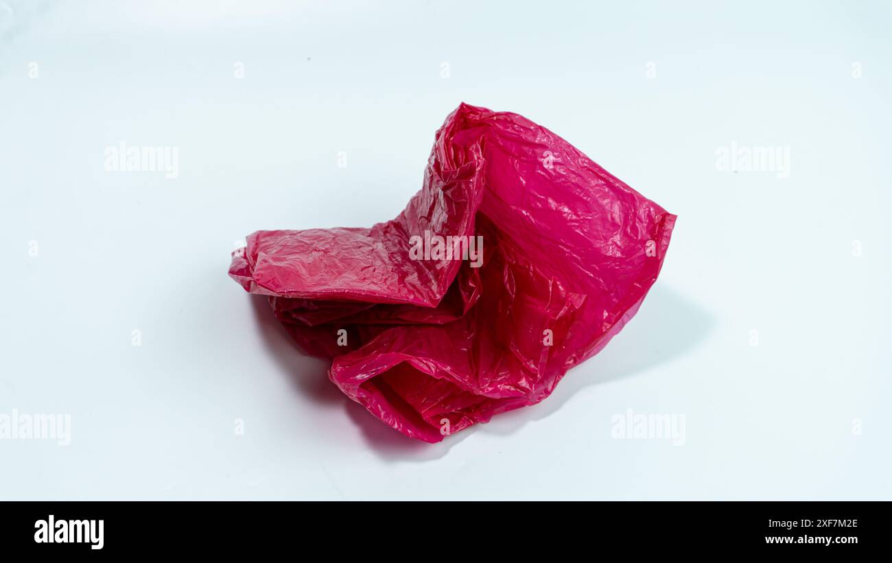 Red plastic bag isolated on white background Stock Photo - Alamy