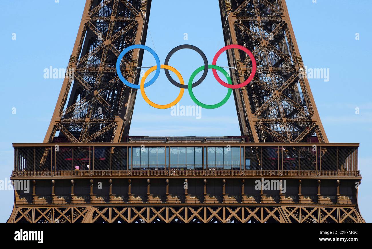 The Olympic five rings mounted on the Eiffel Tower is seen in Paris ...