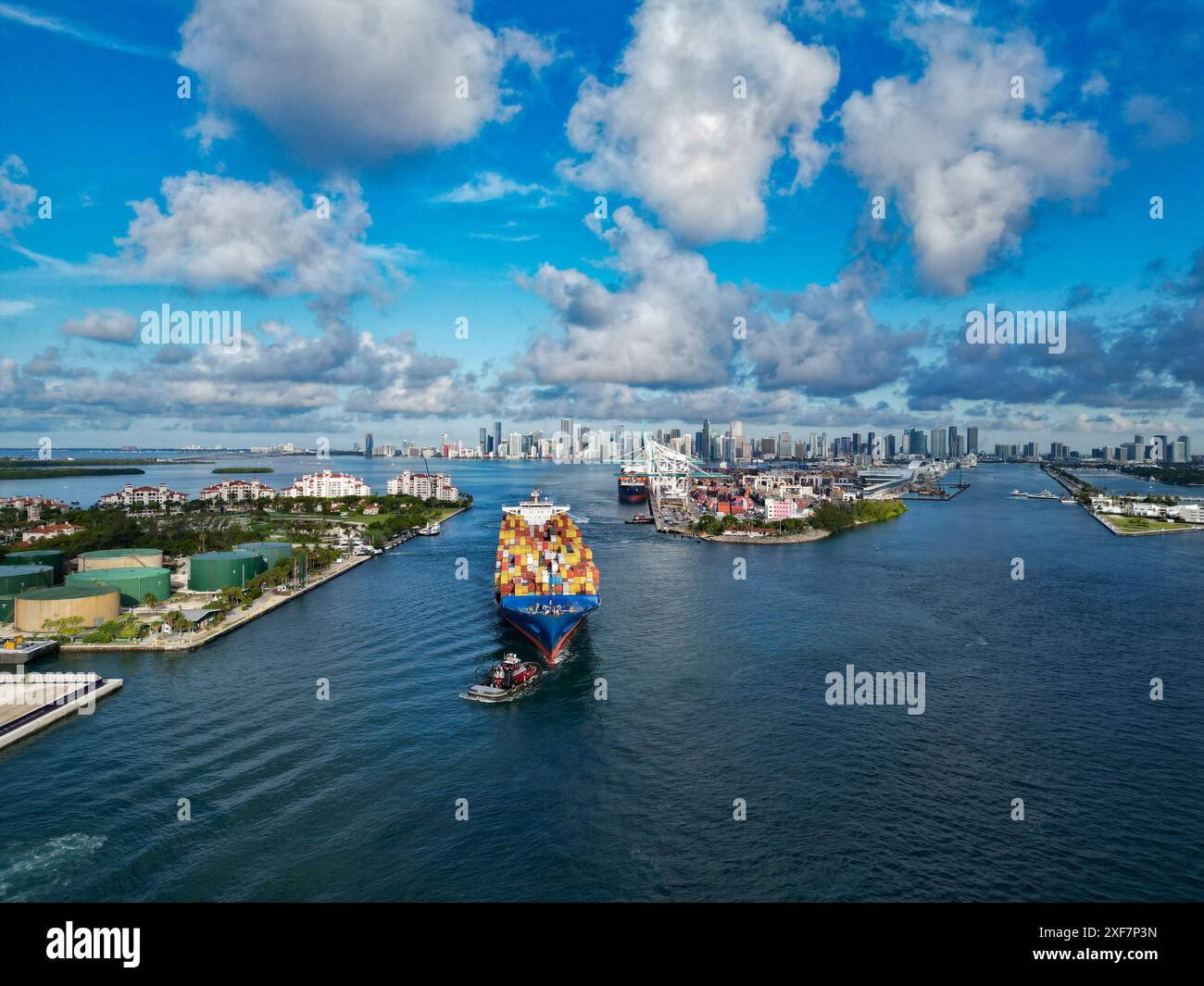 Cargo ship barge aerial view entering Miami downtown Biscayne Bay ...