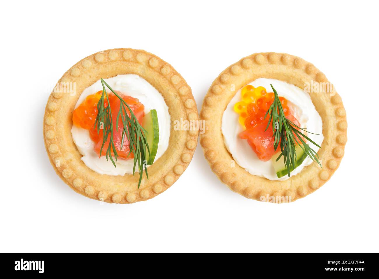 Delicious canapes with salmon and red caviar isolated on white, top ...