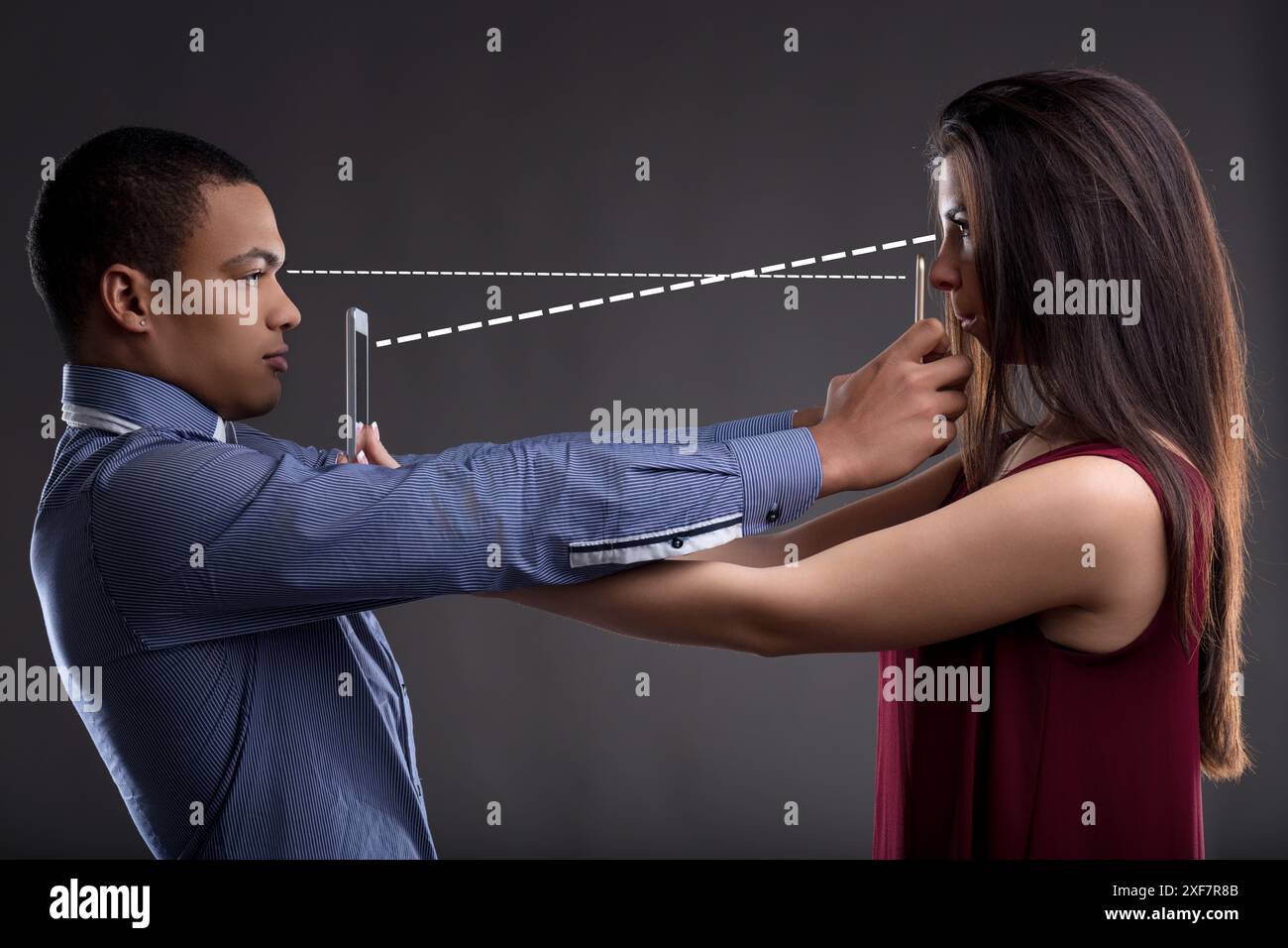 Despite facing each other, their true focus is on their phone screens ...