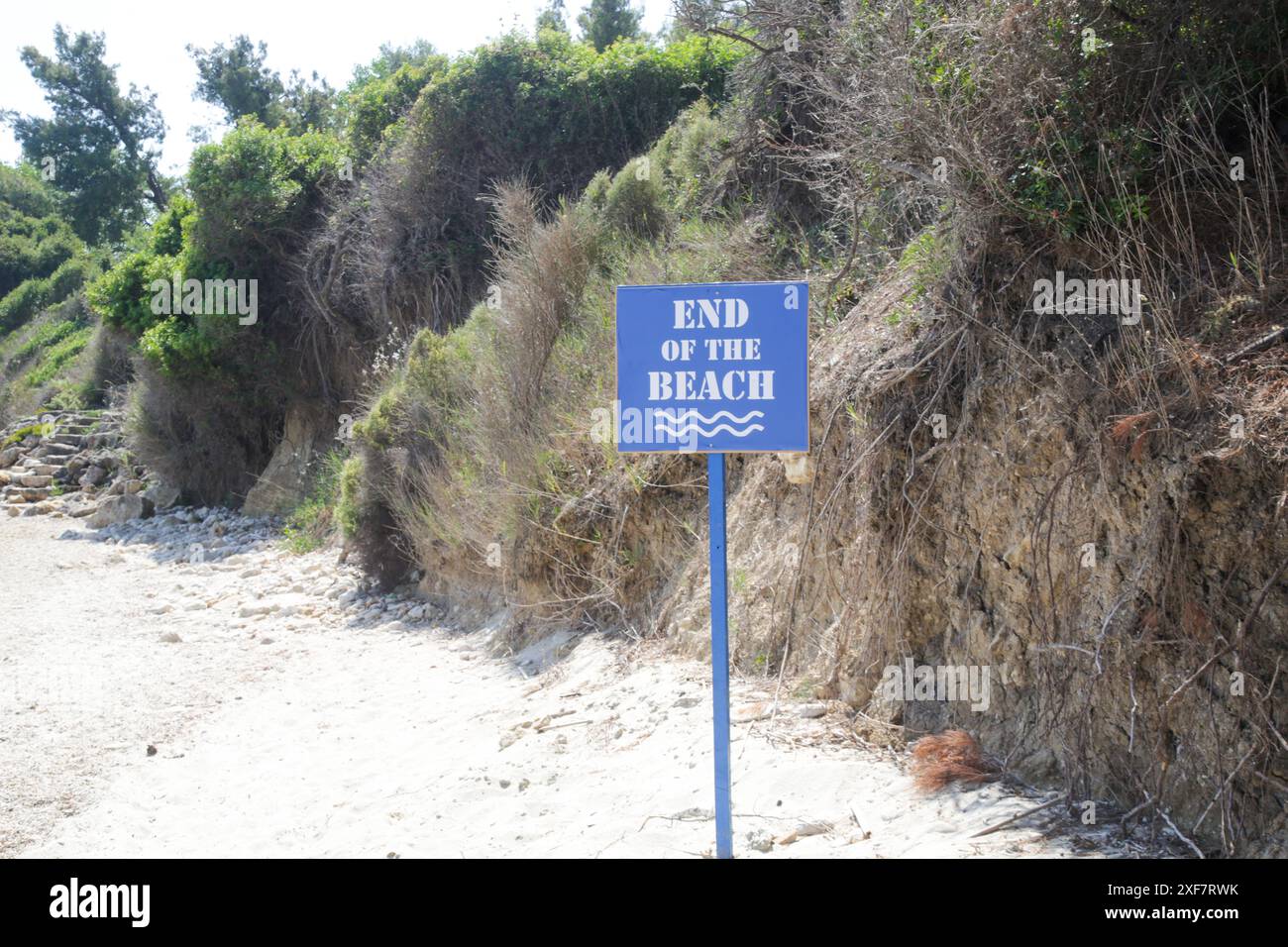 The End Sign on the sand beach Stock Photo - Alamy