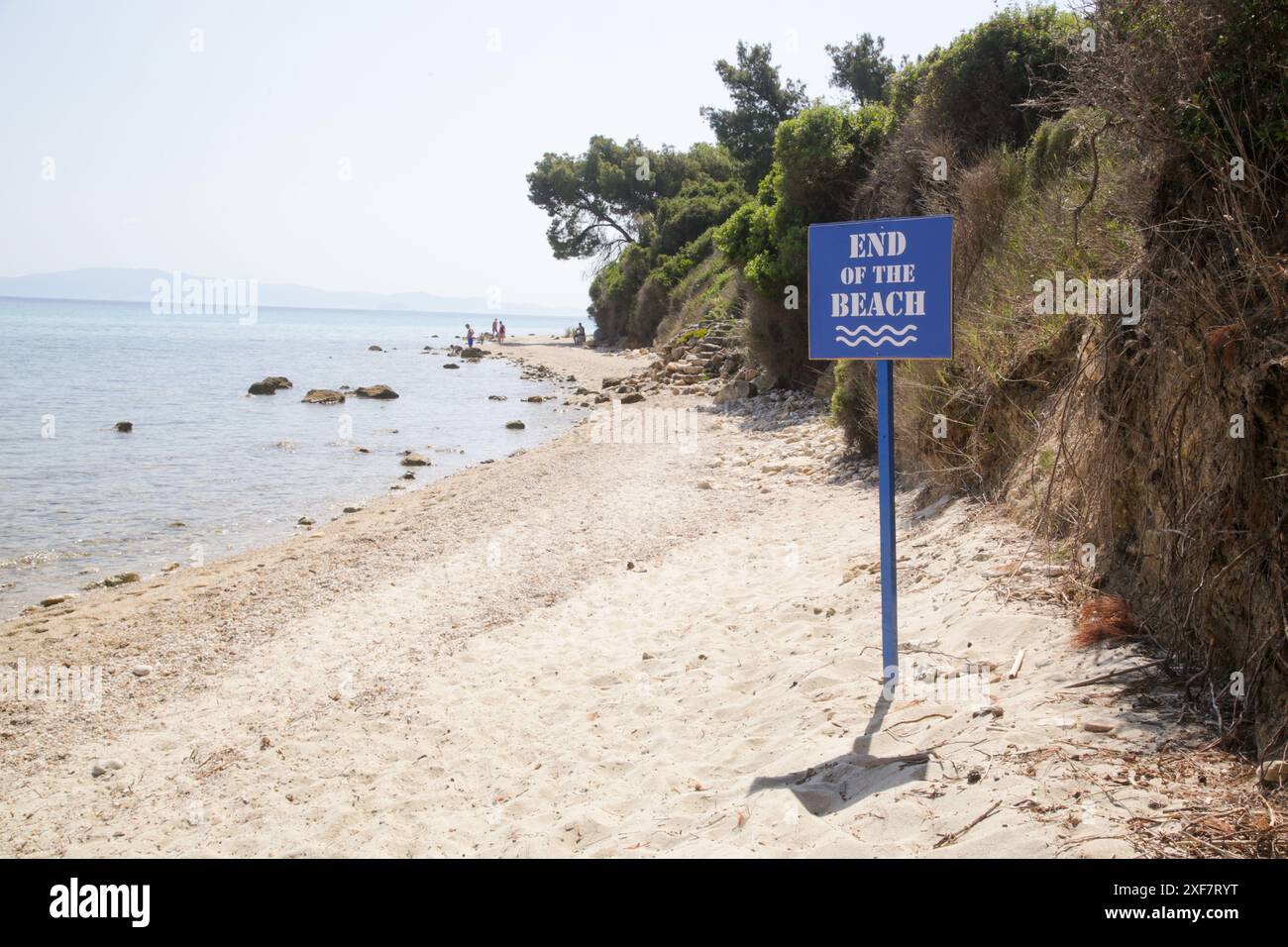 The End Sign on the sand beach Stock Photo - Alamy