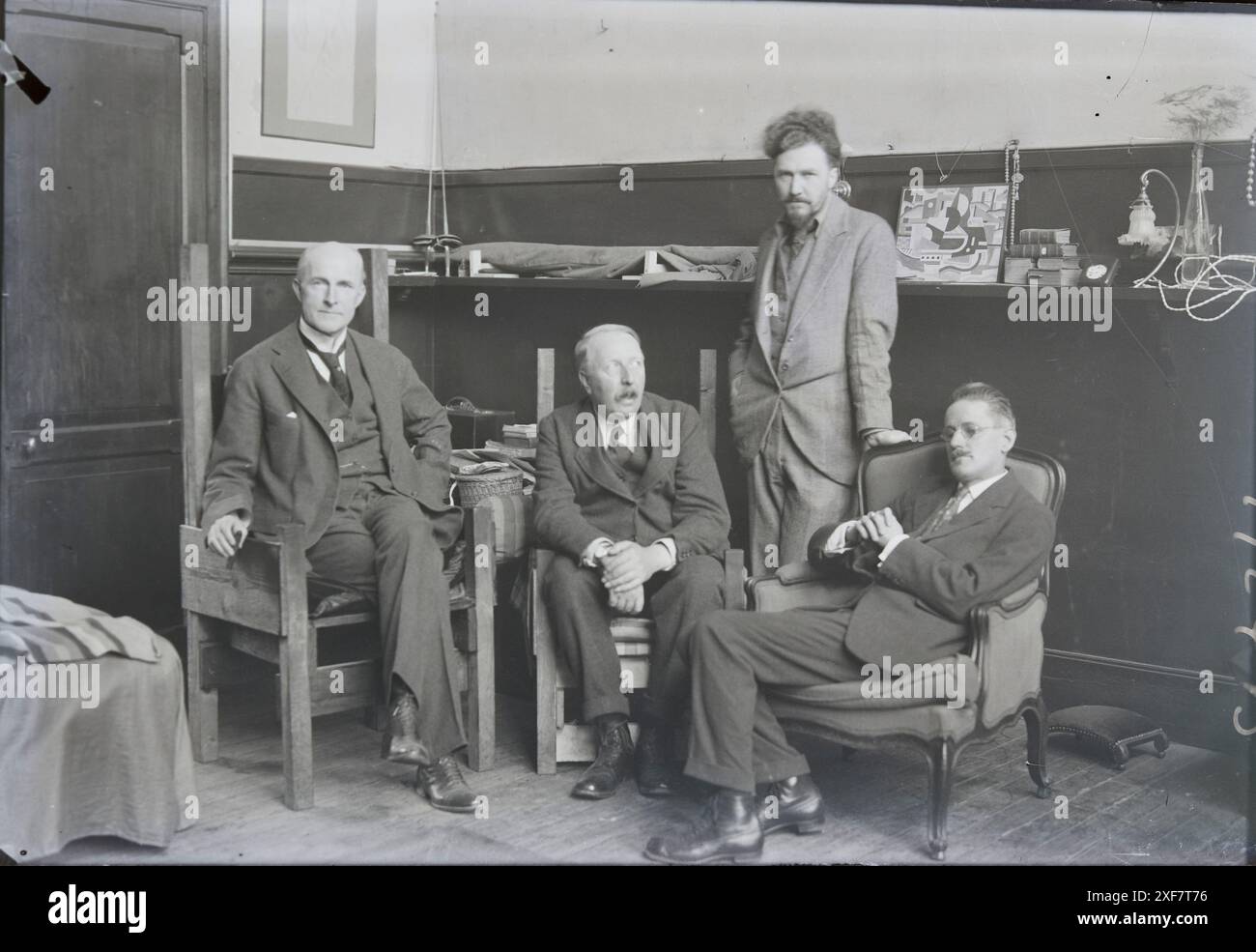 Four internationally-known literary men seen here from left to right ...