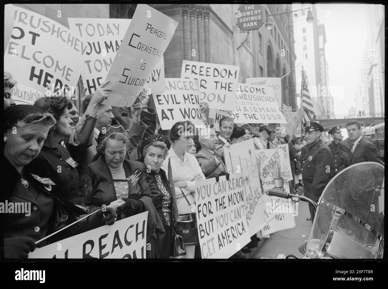 Protesters holding signs with slogans including 'Khrushchev not welcome ...