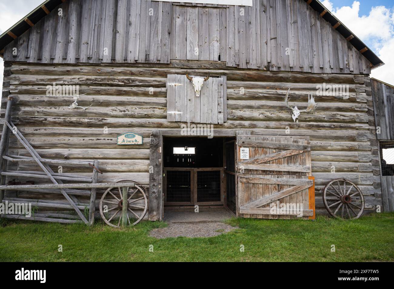 Old log built barn. Old buildings and log cabins at the 108 Mile House ...